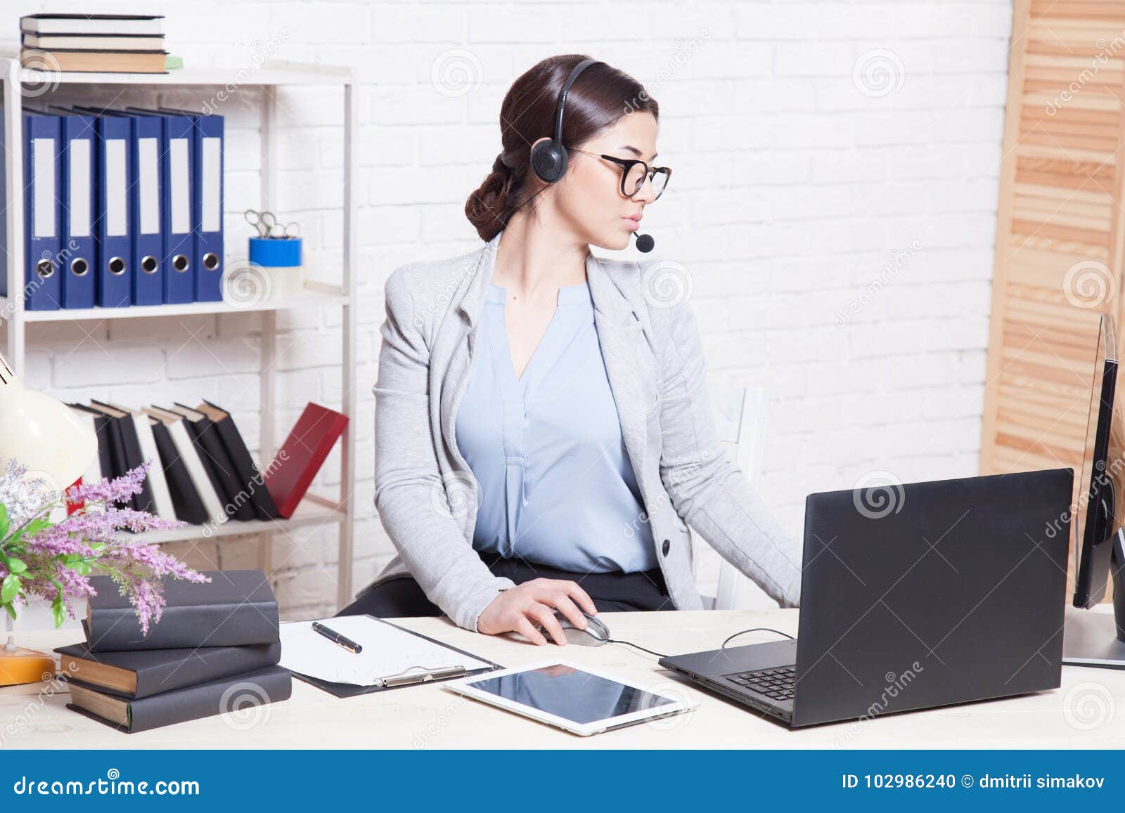 Call Center Operator Works at the Computer in the Office Stock Photo ...