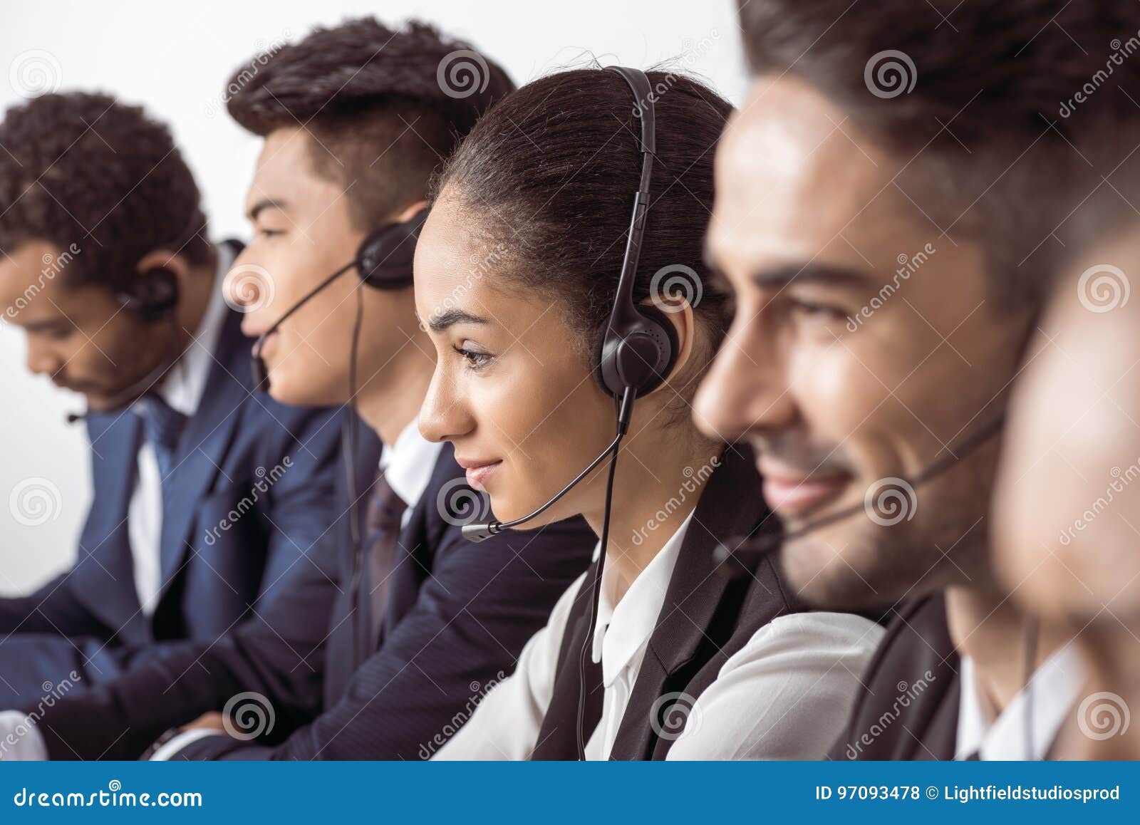 Call Center Operators in Headsets Working Together Stock Photo - Image ...