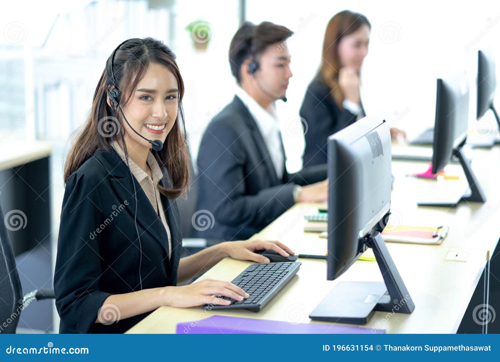 Call Center Worker Accompanied by Her Team. Smiling Customer Support ...