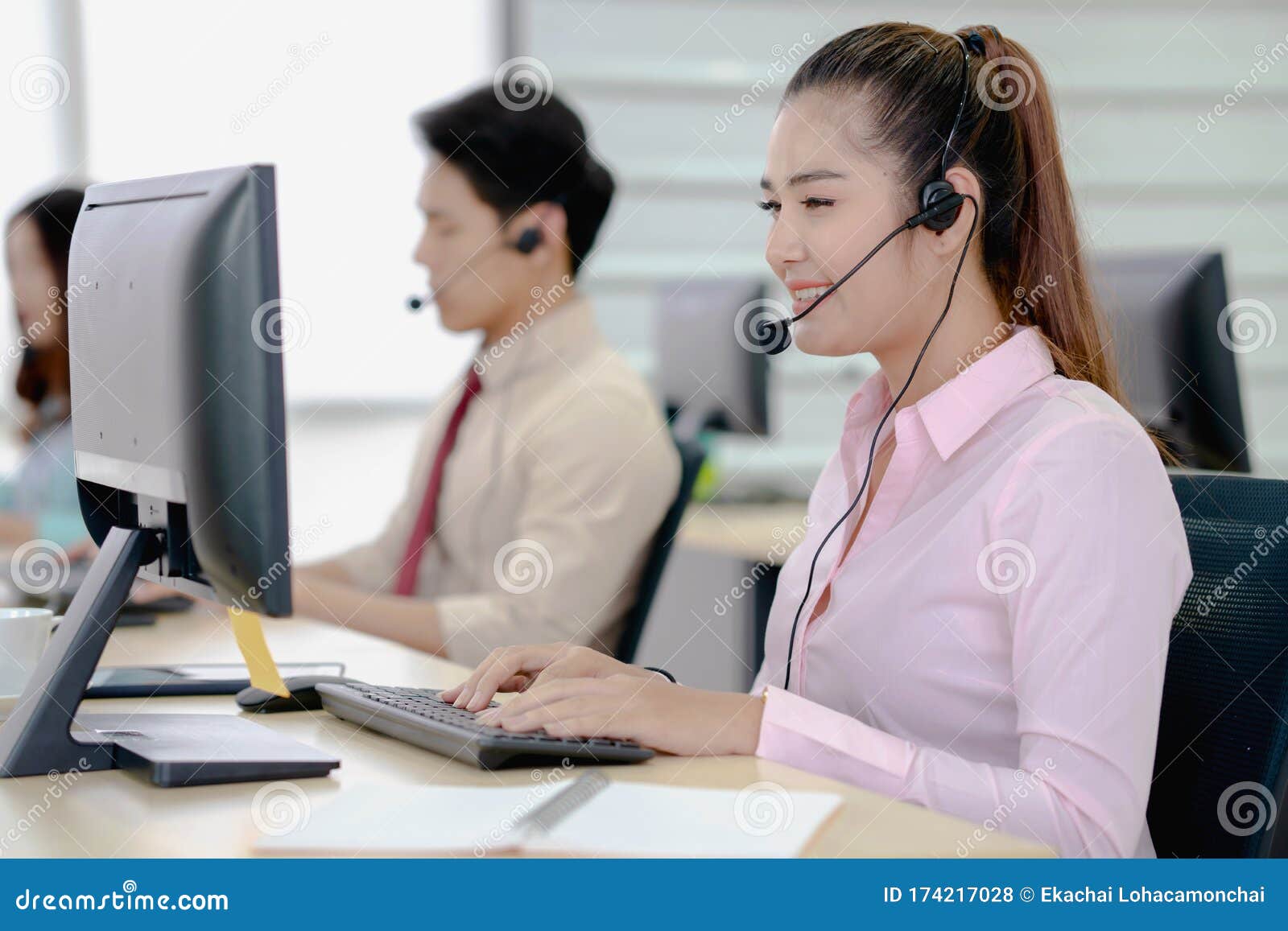 Call Center Worker Accompanied by Her Team Stock Photo - Image of ...