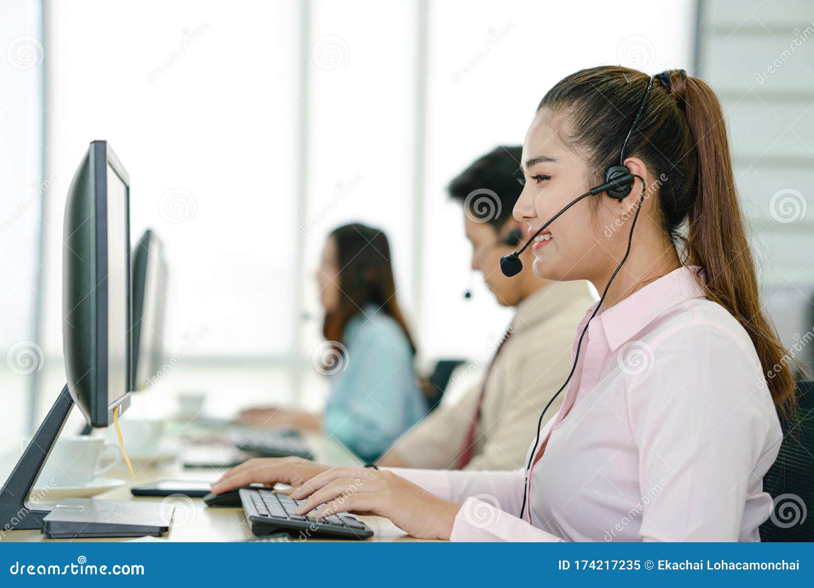 Call Center Worker Accompanied by Her Team Stock Image - Image of ...