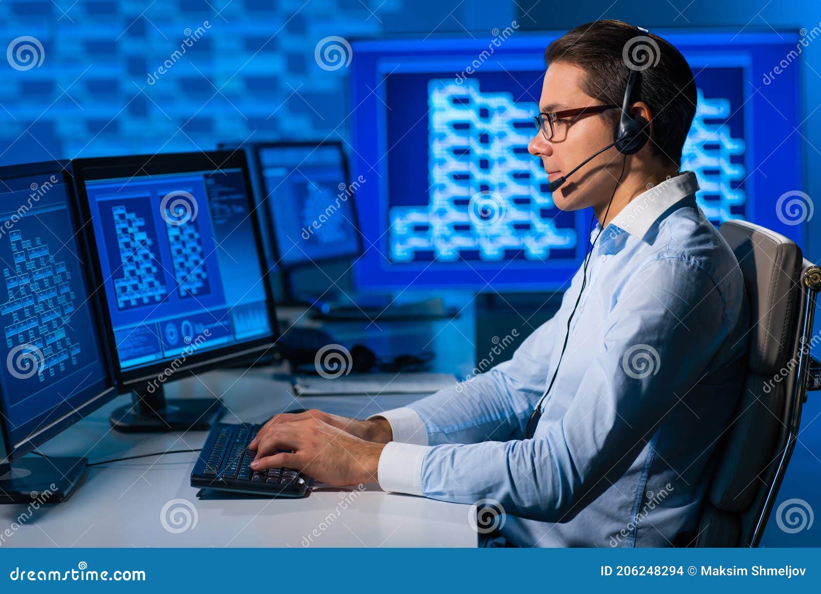 Call-center Worker is Speaking with the Client by Headset. Workplace of ...