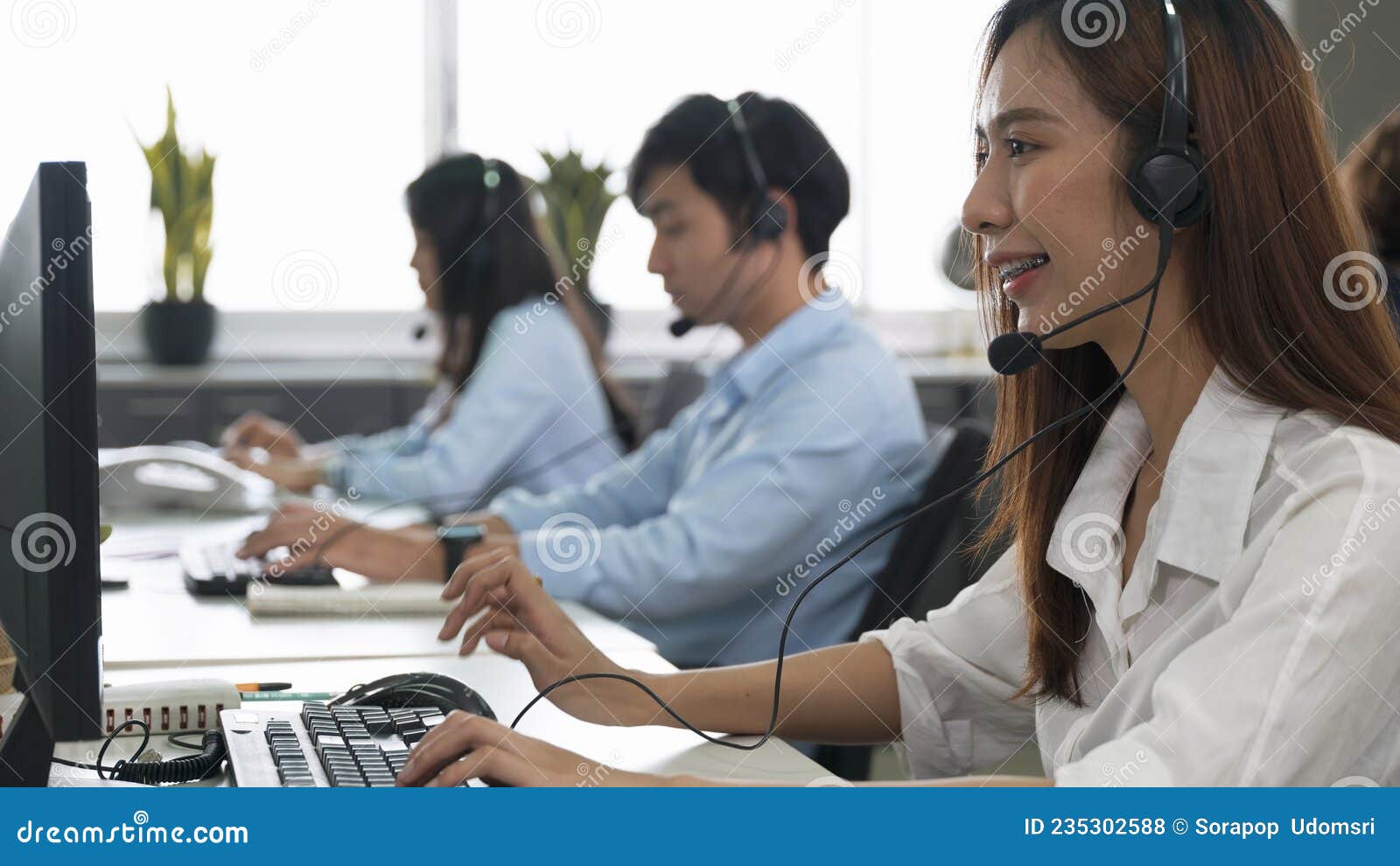 Call Center Young Employee Working with Headset, Smiling Customer ...