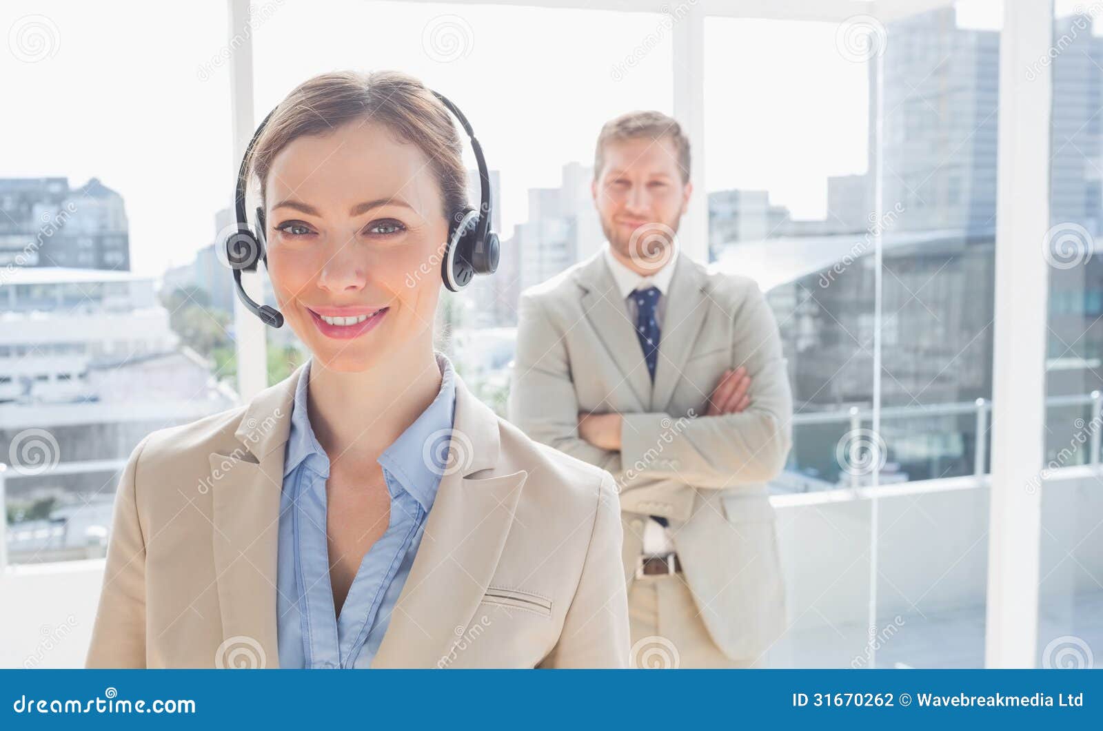 Call Centre Agent Standing with Colleague Behind Her Stock Photo ...
