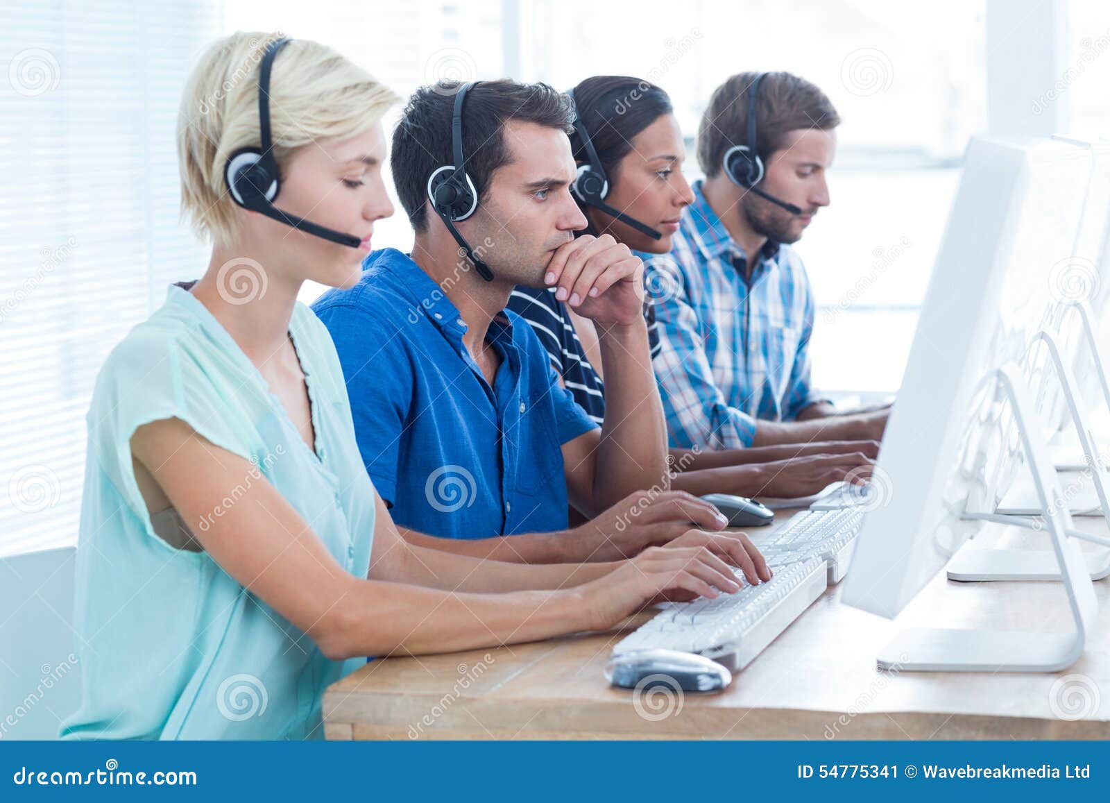 Call Centre Workers on Their Laptops Stock Image - Image of male ...