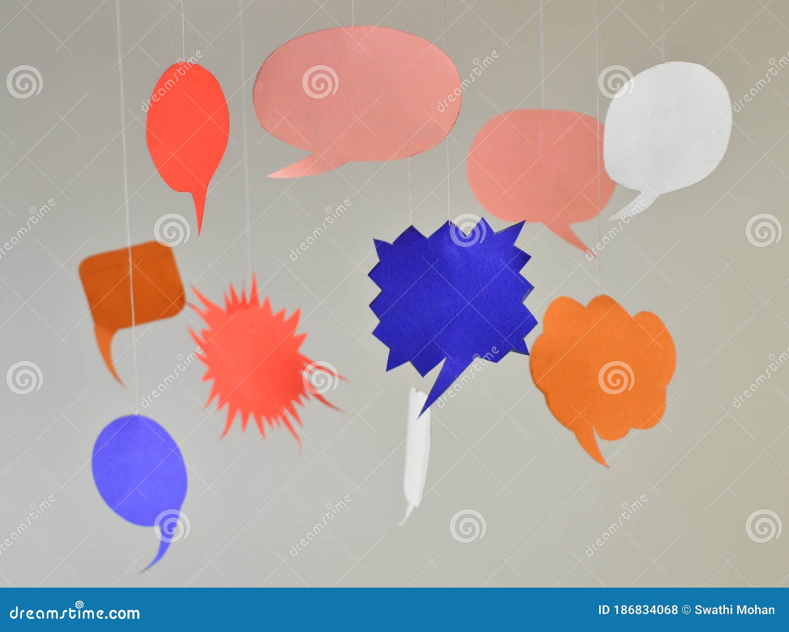 Call Outs Made of Paper Hanging from Threads Stock Photo - Image of ...