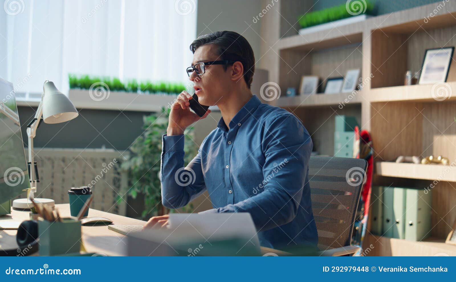 Calling Businessman Typing Computer Keyboard at Workplace. Man Talking ...