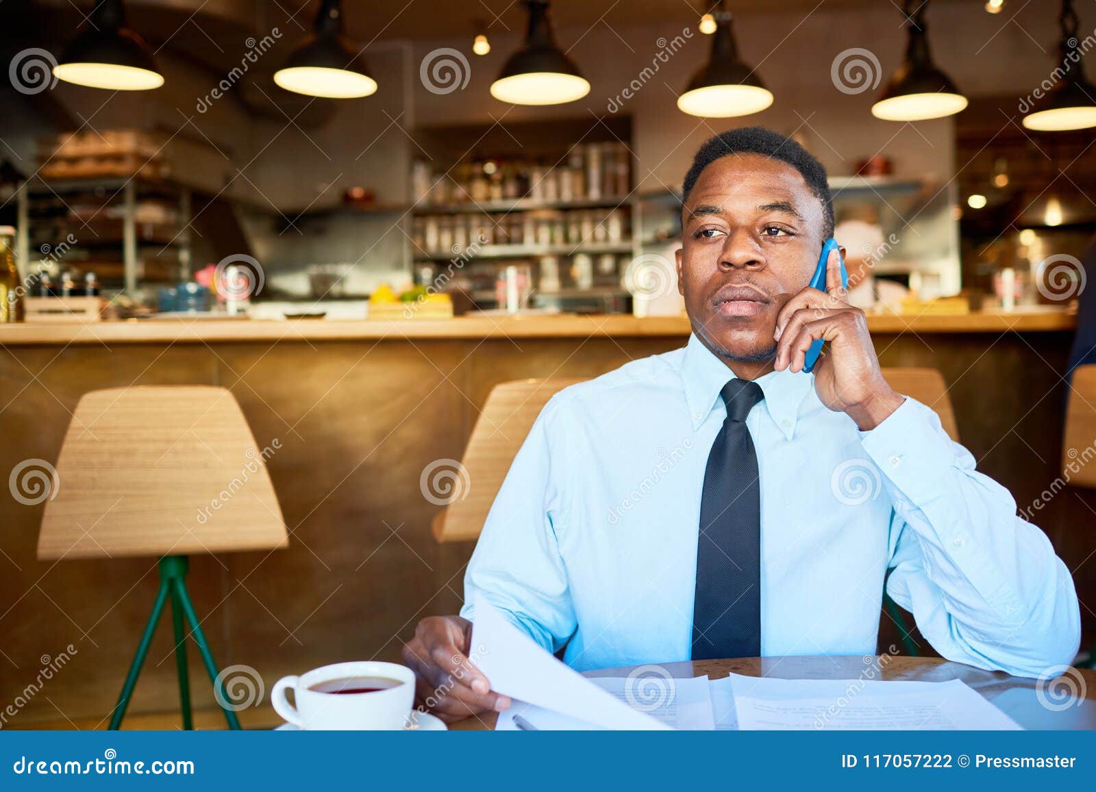 Calling in cafe stock photo. Image of calling, mobile - 117057222