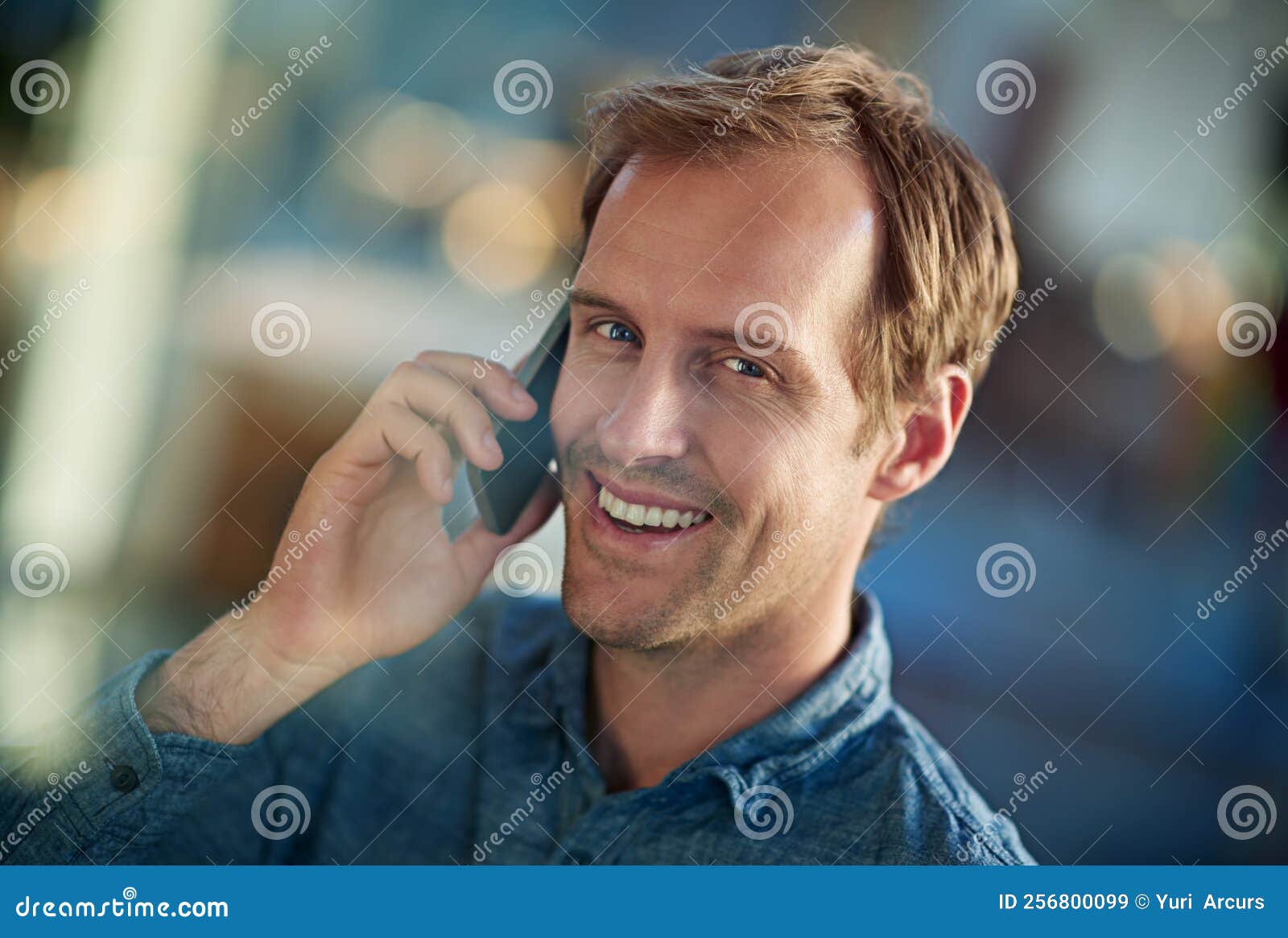 Calling a Client. a Handsome Businessman Talking on His Mobile Phone in ...
