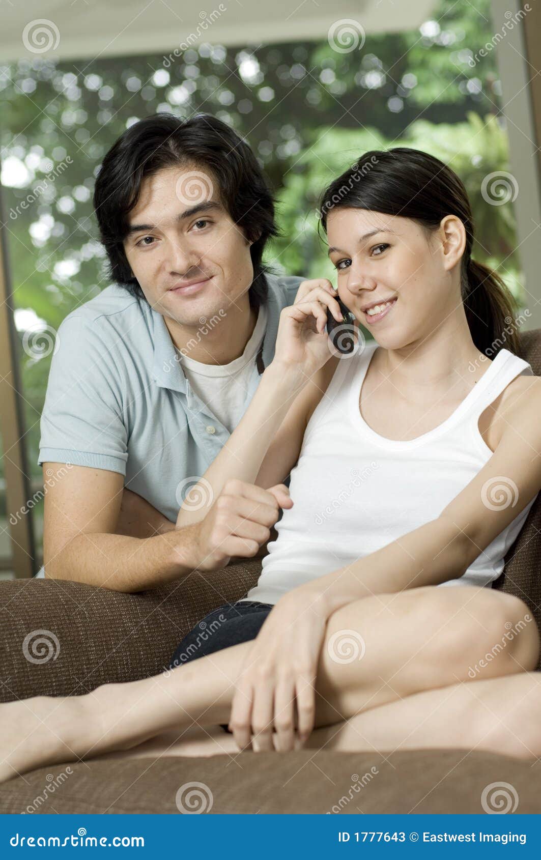 Calling from Home stock image. Image of young, sofa, phone - 1777643