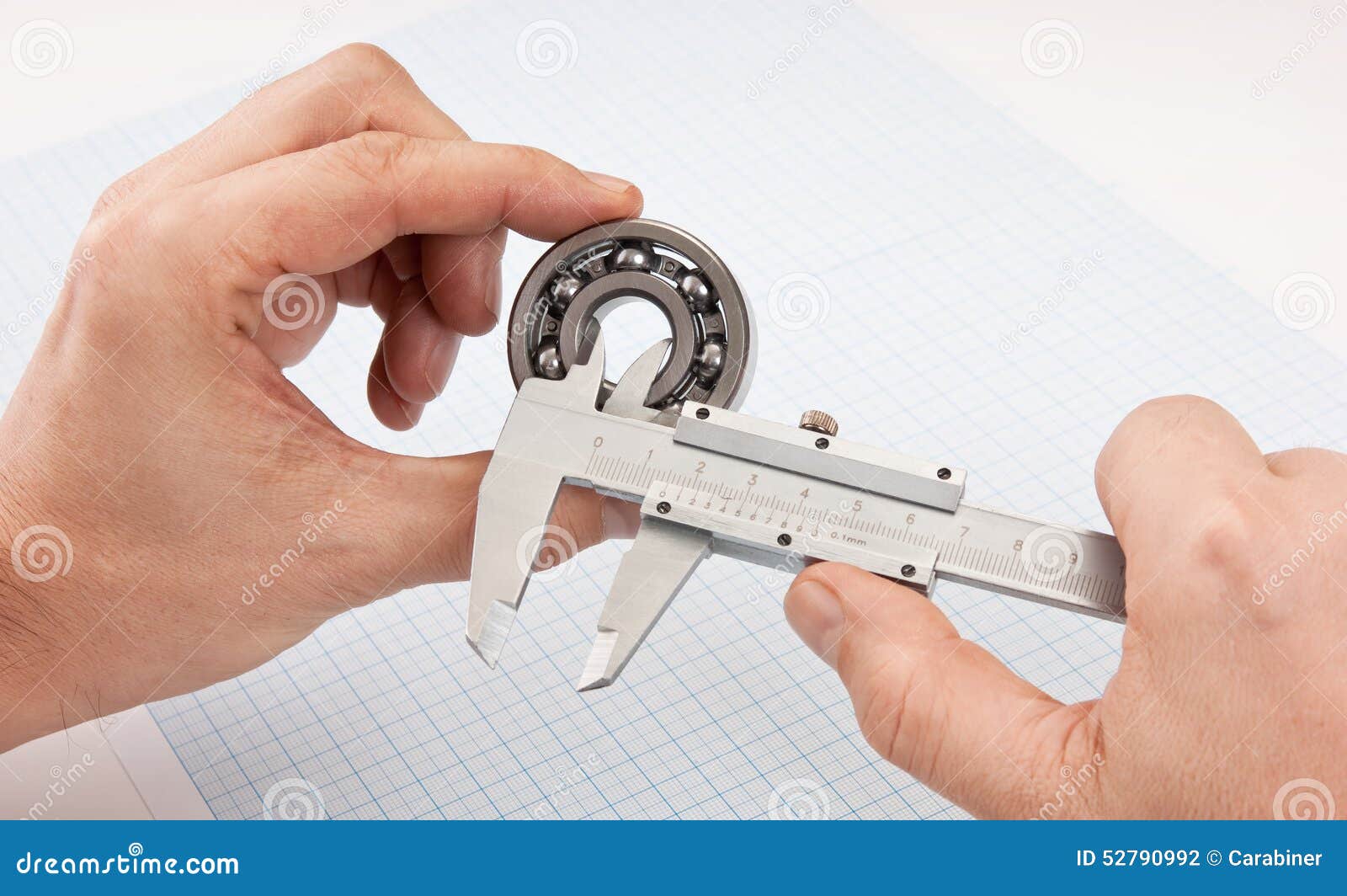 Callipers with Bearing in Hand Stock Photo - Image of engineering ...