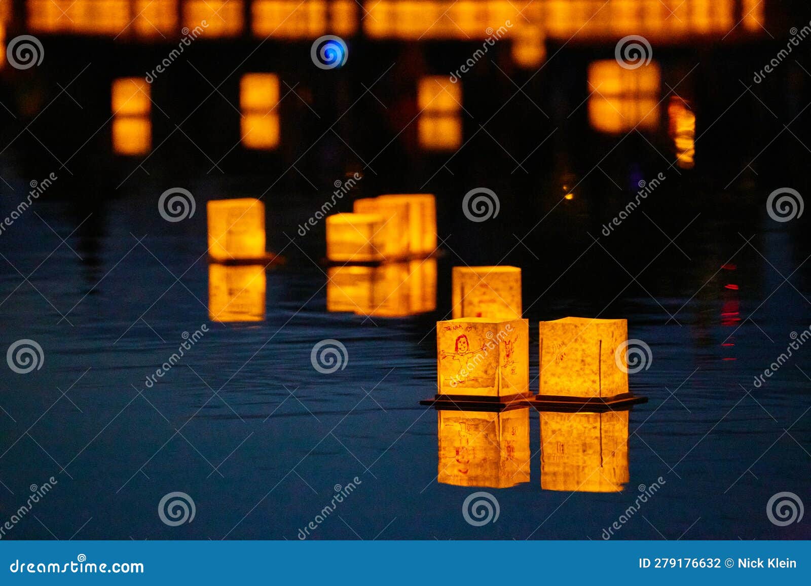 Calm Deep Dark Blue Pond with Golden Lanterns Stock Photo - Image of ...