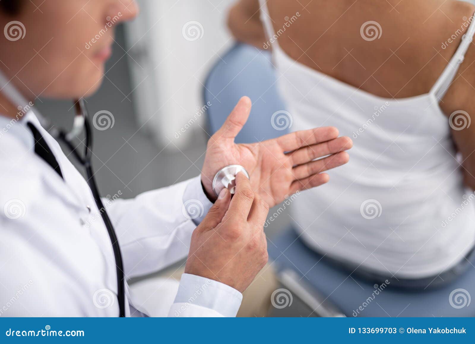 Calm Doctor Putting Stethoscope on His Hand Stock Image - Image of ...