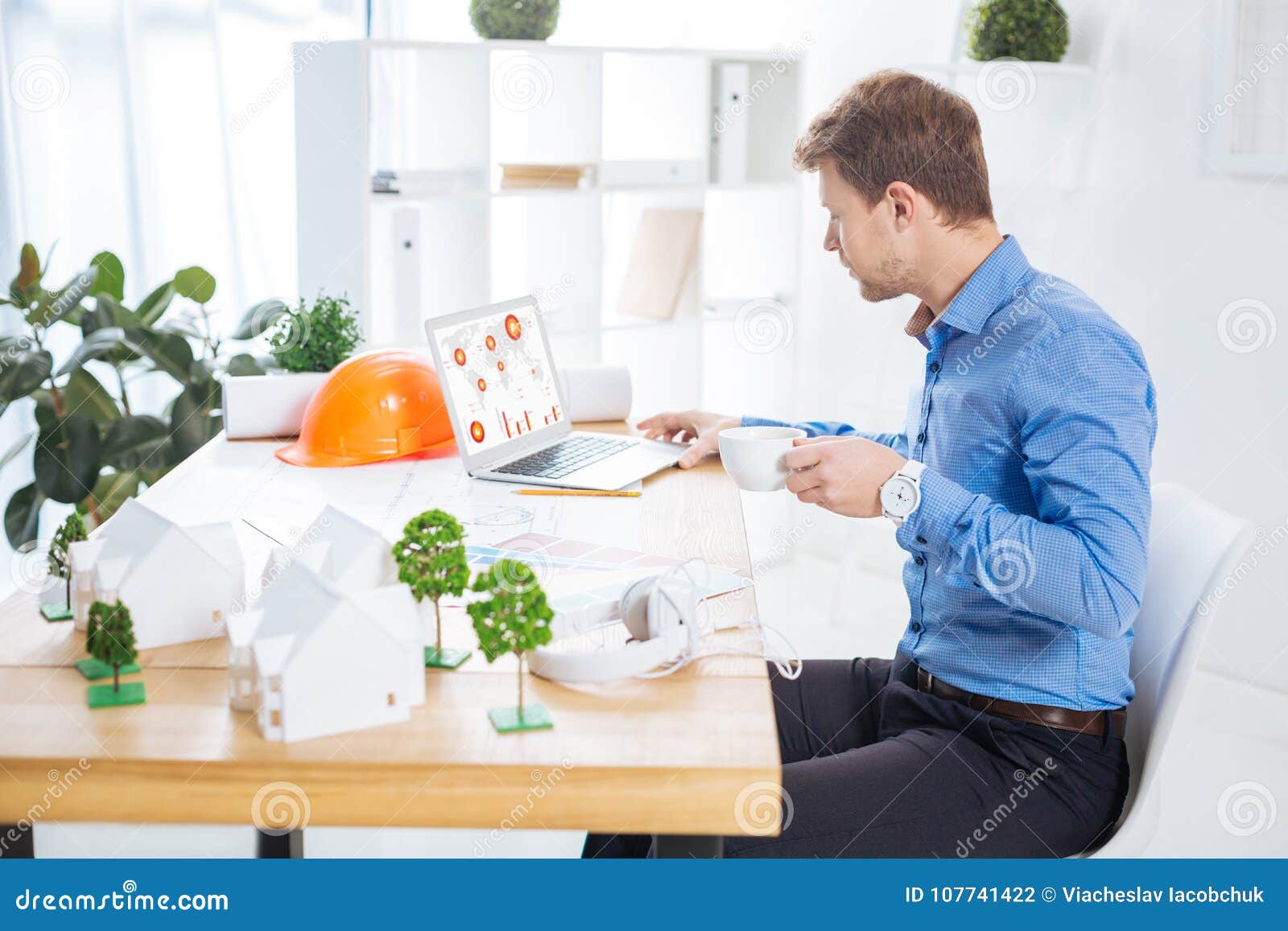 Calm Engineer Drinking Coffee and Reading the Latest Reports Stock ...