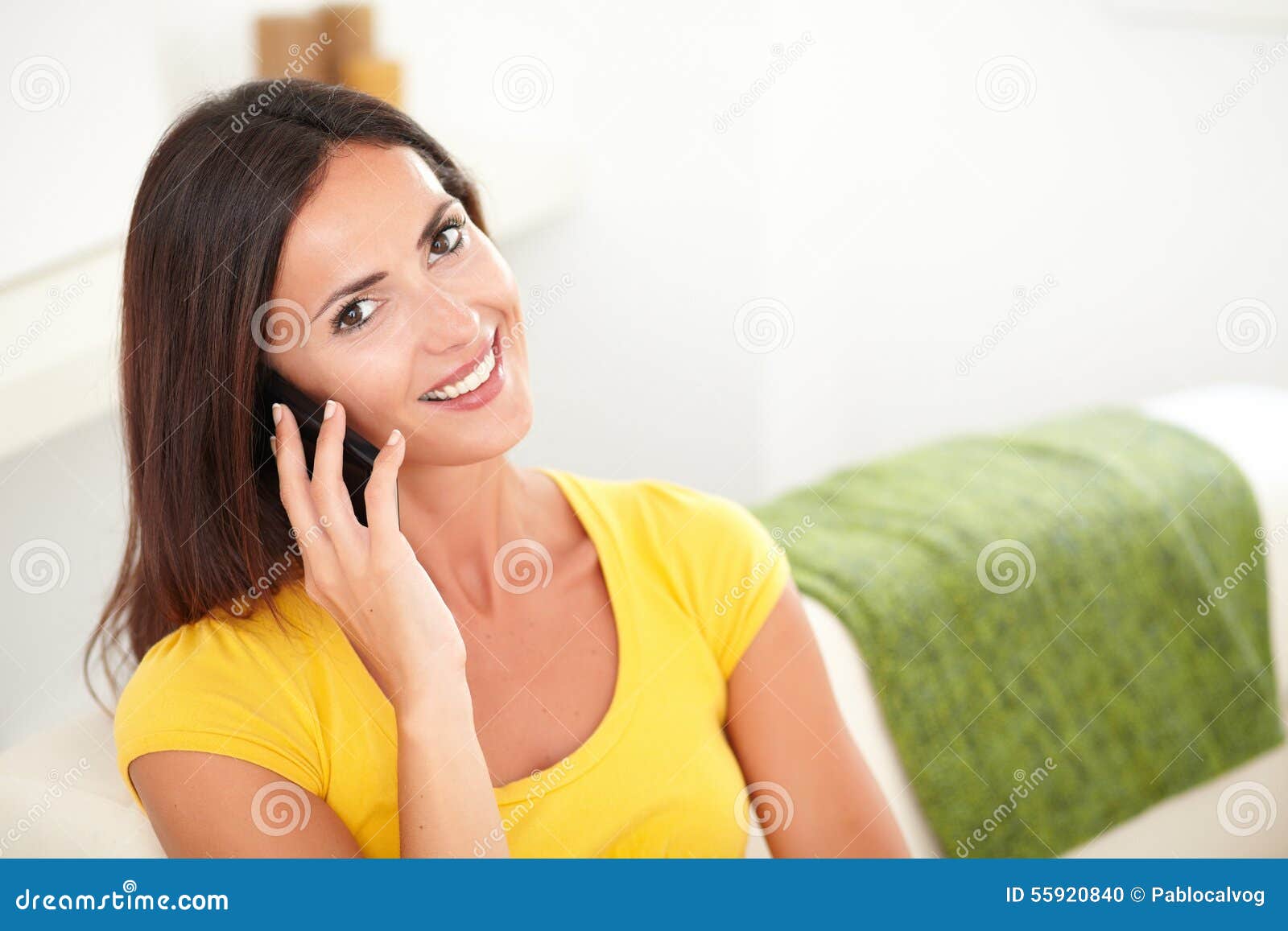 Calm Lady Smiling while Talking on Her Cell Phone Stock Photo - Image ...