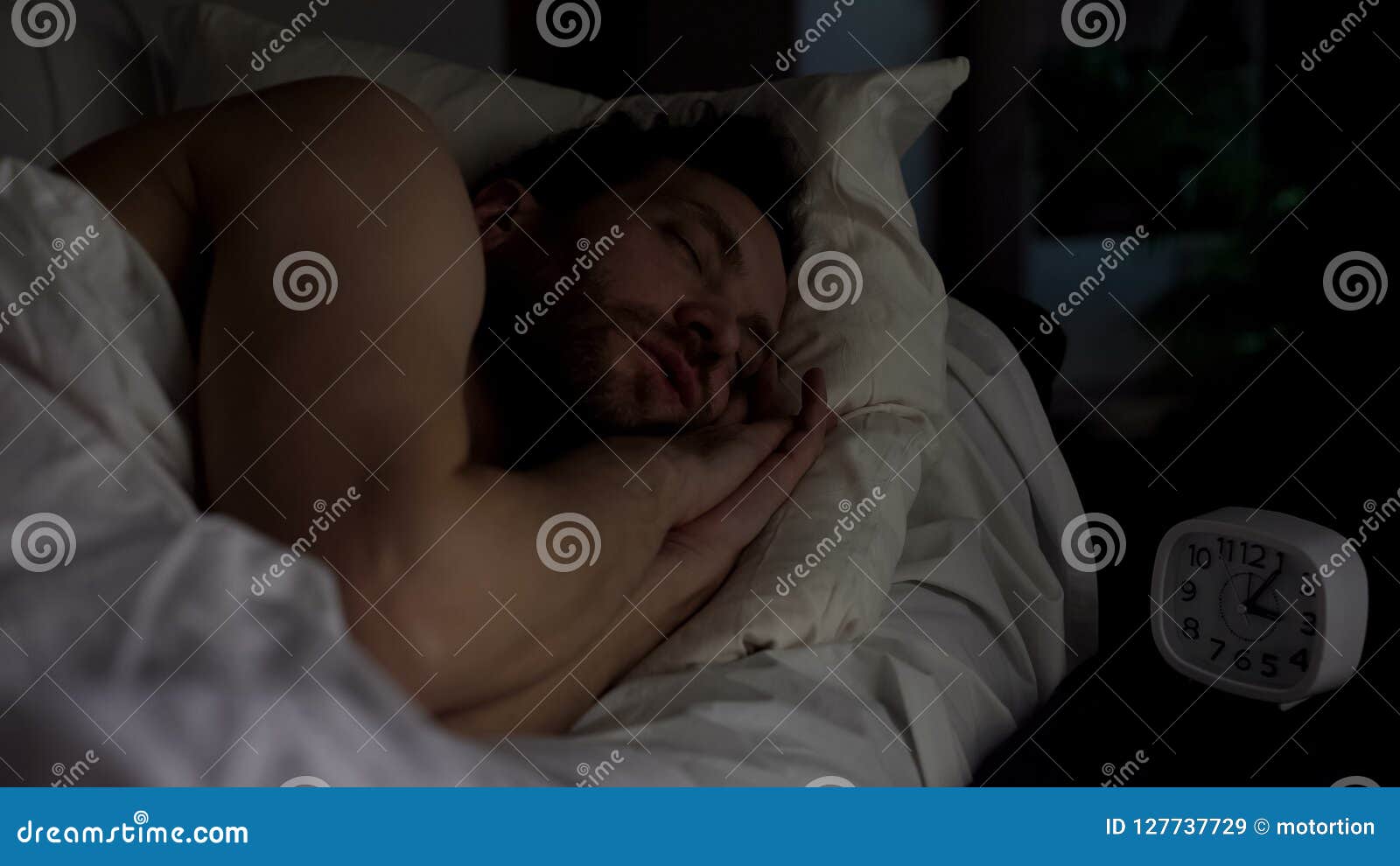 Calm Man Sleeping on Sofa, Clock Standing on Night Table, Late Night ...