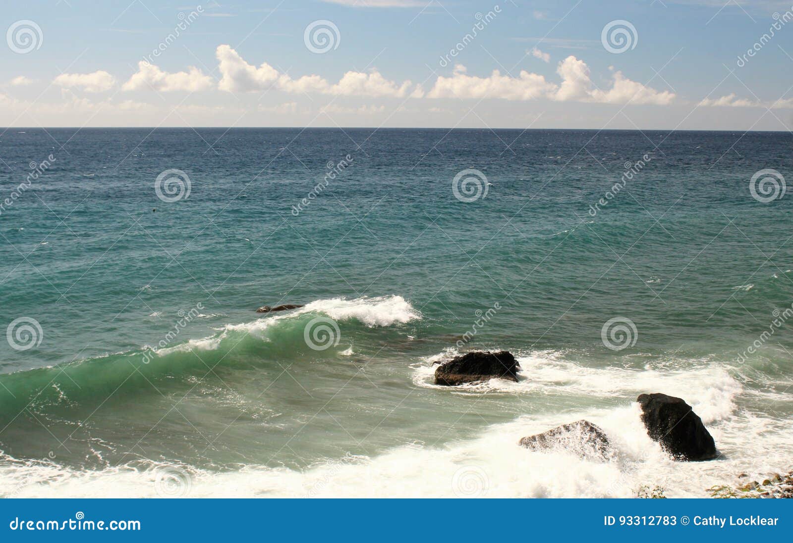 Calm Ocean Seas Background and a Blue Sky with White Clouds Stock Image ...