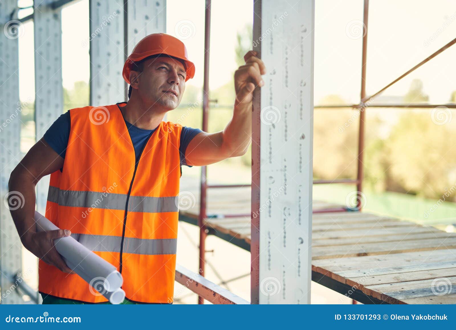 Curious Builder Touching the Incomplete Construction and Holding ...