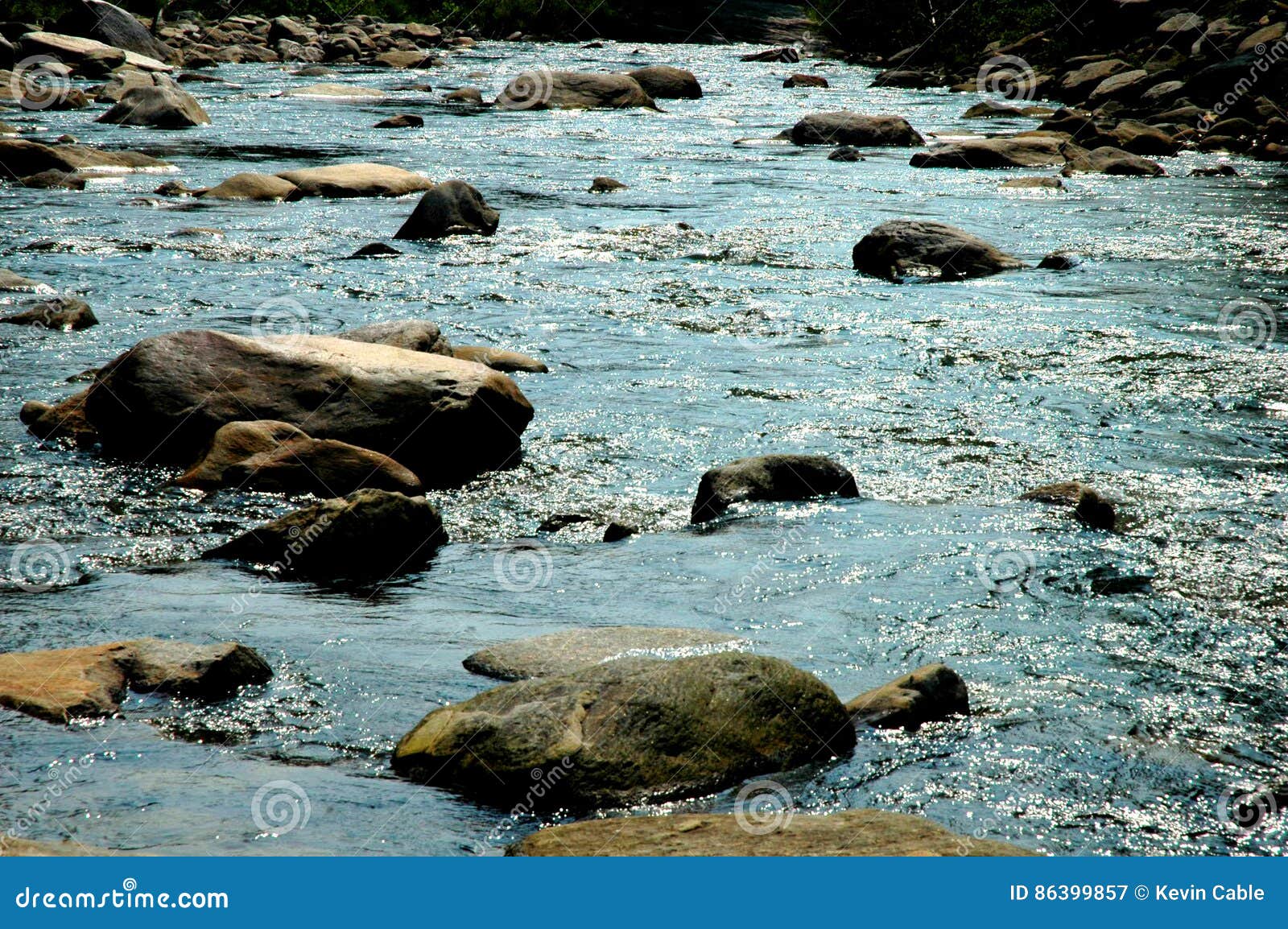 Calm river with rocks stock image. Image of calm, rocks - 86399857
