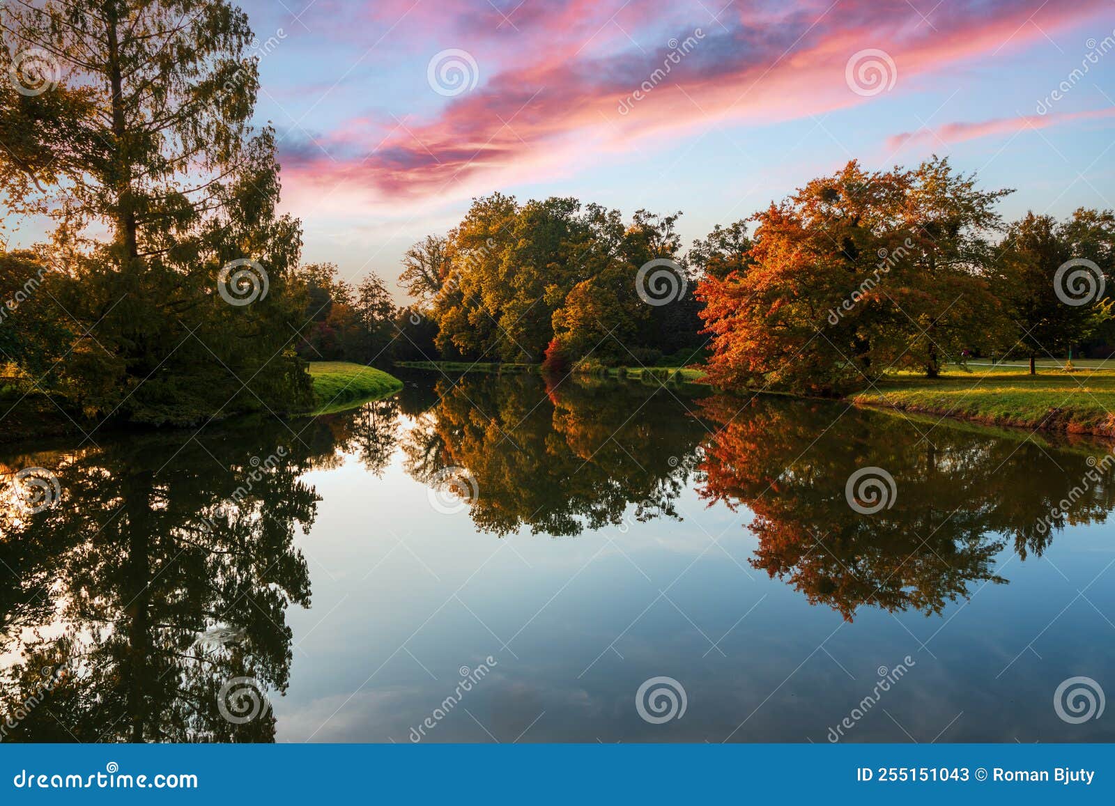 Calm River in the Setting Sun. Around the River are Colorful Trees and ...