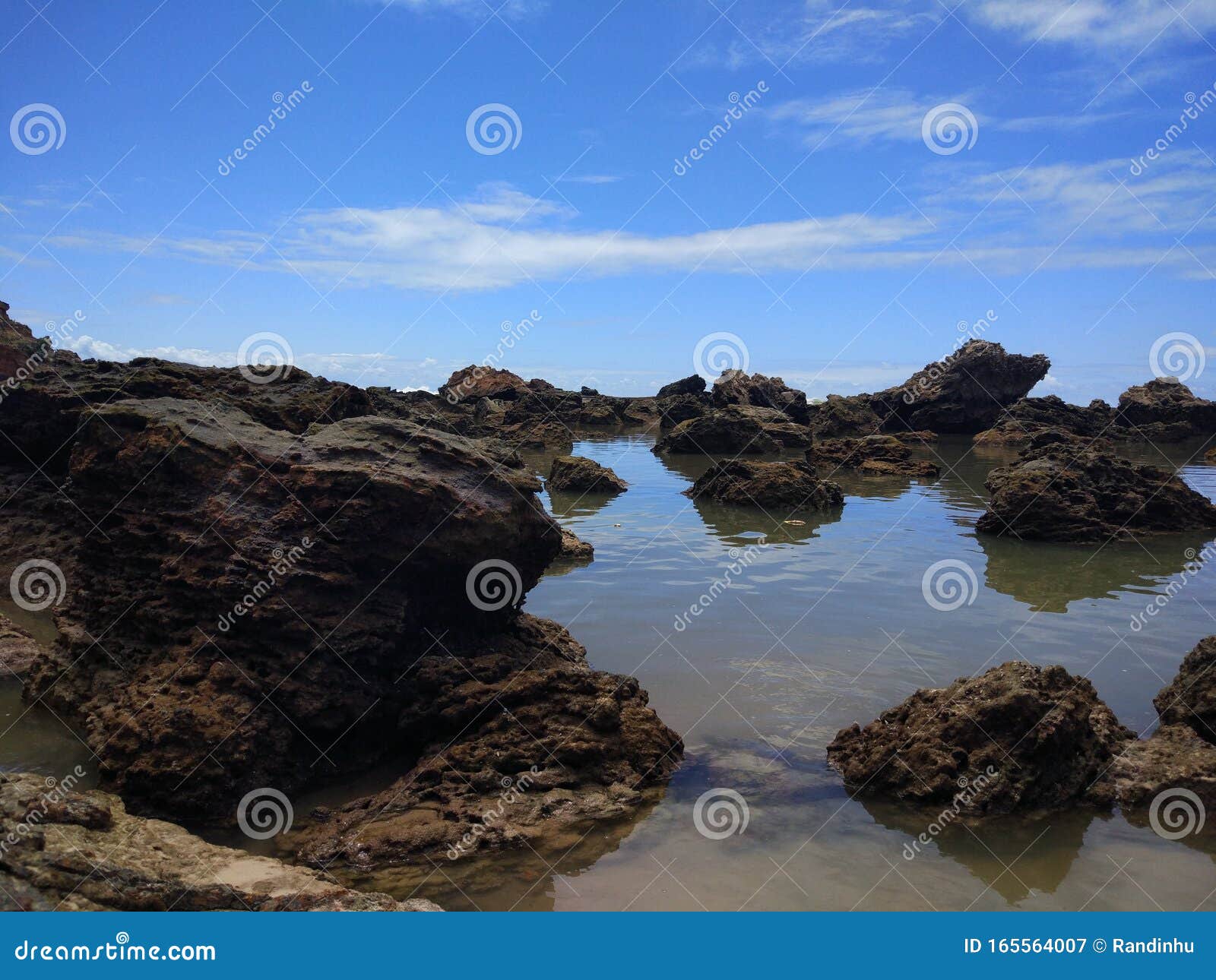 Calm sea with rocks stock image. Image of calm, beach - 165564007