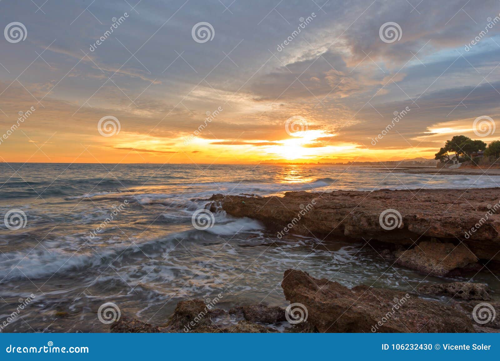 The Calm Sea in a Very Cloudy Sunset Stock Photo - Image of rock ...