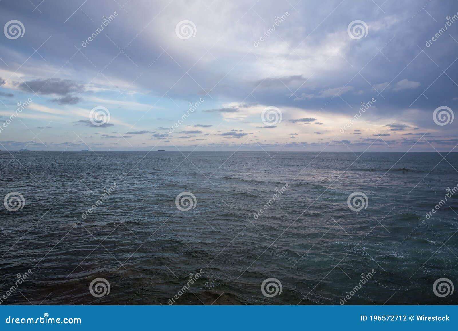 Calm Smooth Seawater Surface Under a Beautifully Clouded Sky Stock ...