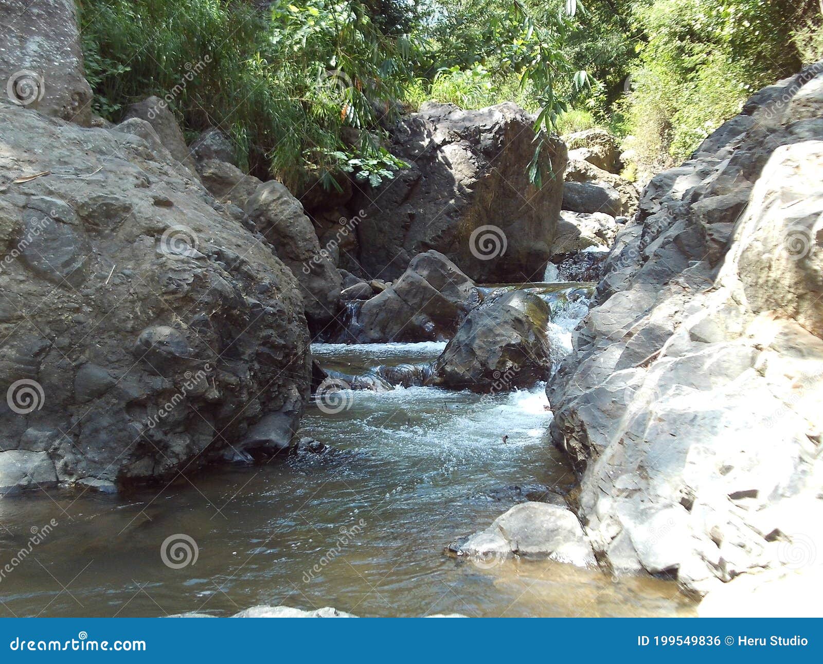 Calm Stream River Water through Large Rock Gaps on Either Side Stock ...