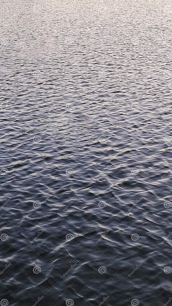 Serene Rippling Water Surface at Sunset. Water Background Stock Photo ...