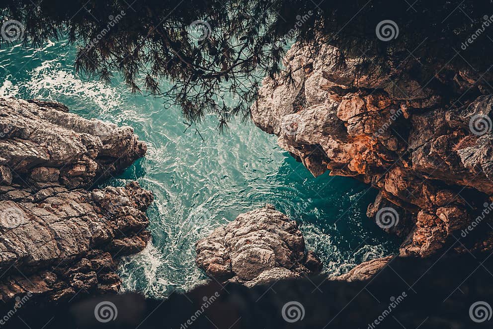 Calm Turquoise Water with Waves and Rocks Stock Photo - Image of water ...