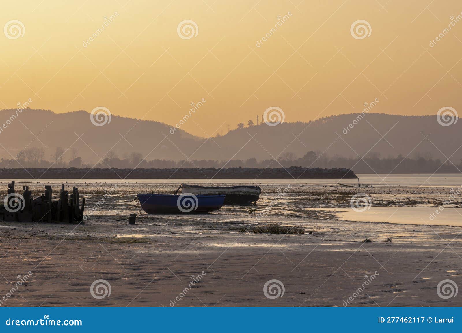 The Calm Water of the Ria Reflecting the Sun and the Clouds Stock Image ...