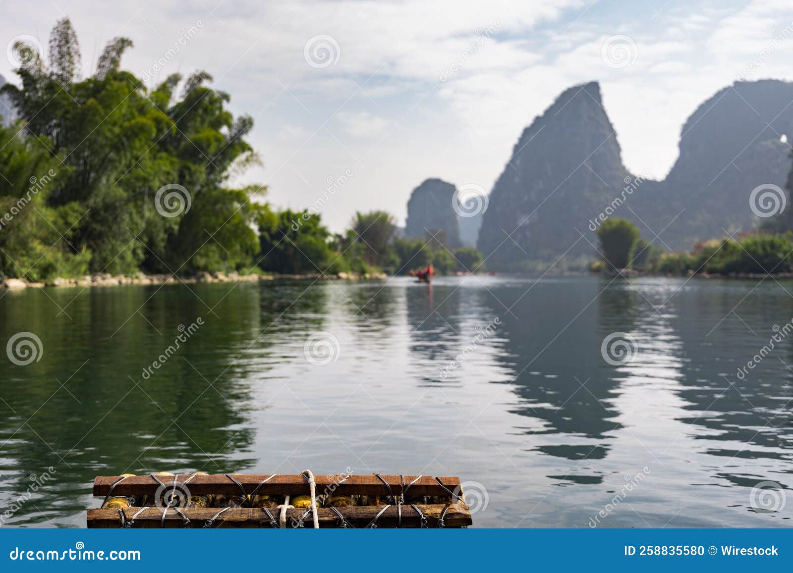 Calm Yangshuo Lake in China with Reflections of Trees and Mountains on ...