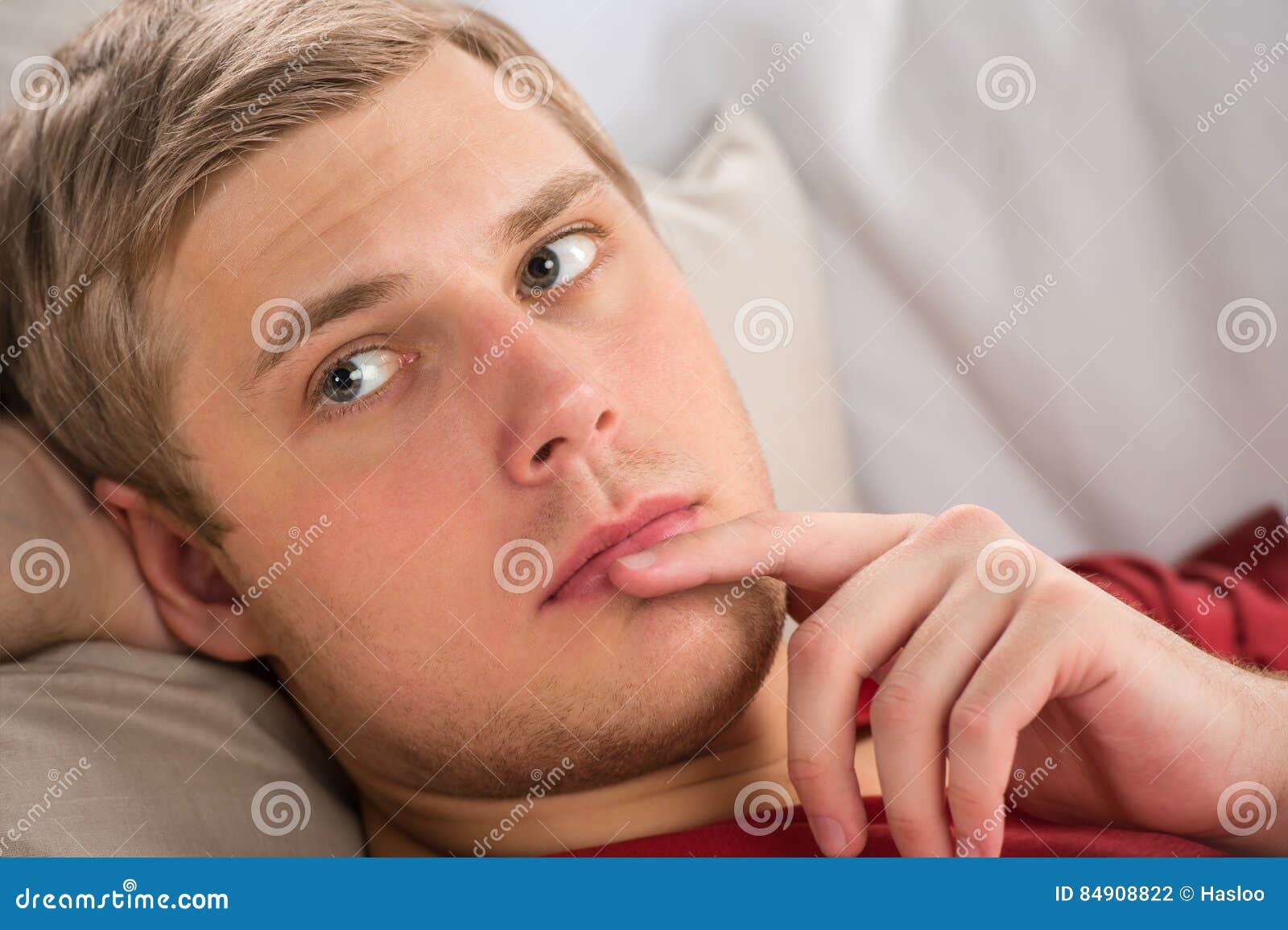 Calm Young Man Laying on Sofa and Thinking Stock Photo - Image of cute ...
