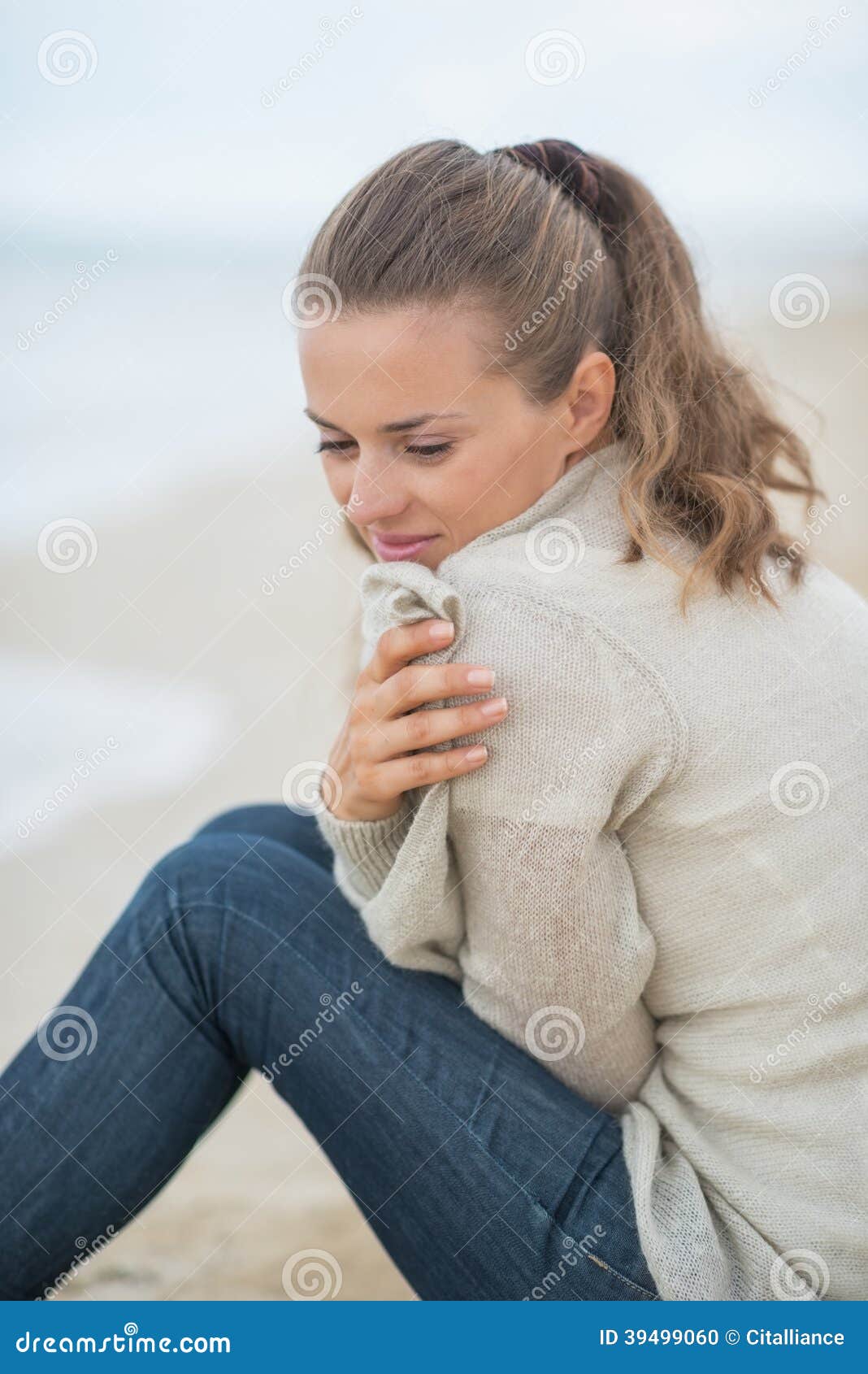 Calm Young Woman Sitting on Cold Beach Stock Photo - Image of coast ...
