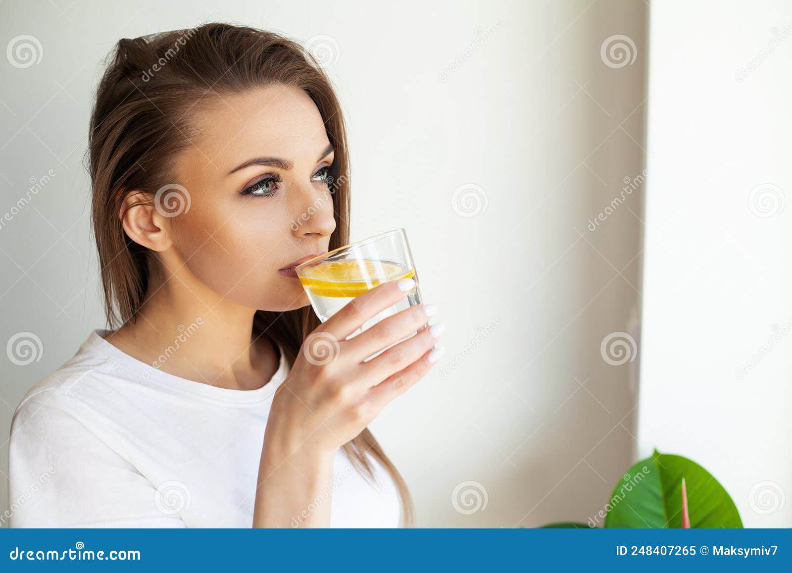 Calm Youthful Lady Refreshing Herself with Lemon Water Stock Image ...
