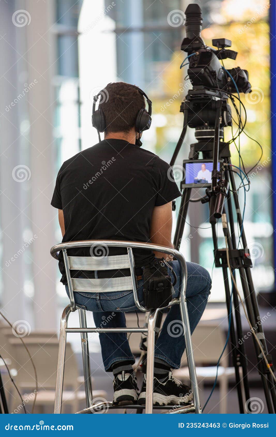 Camcorder Operator Filming Live Show Sitting on a Chair Editorial Stock ...