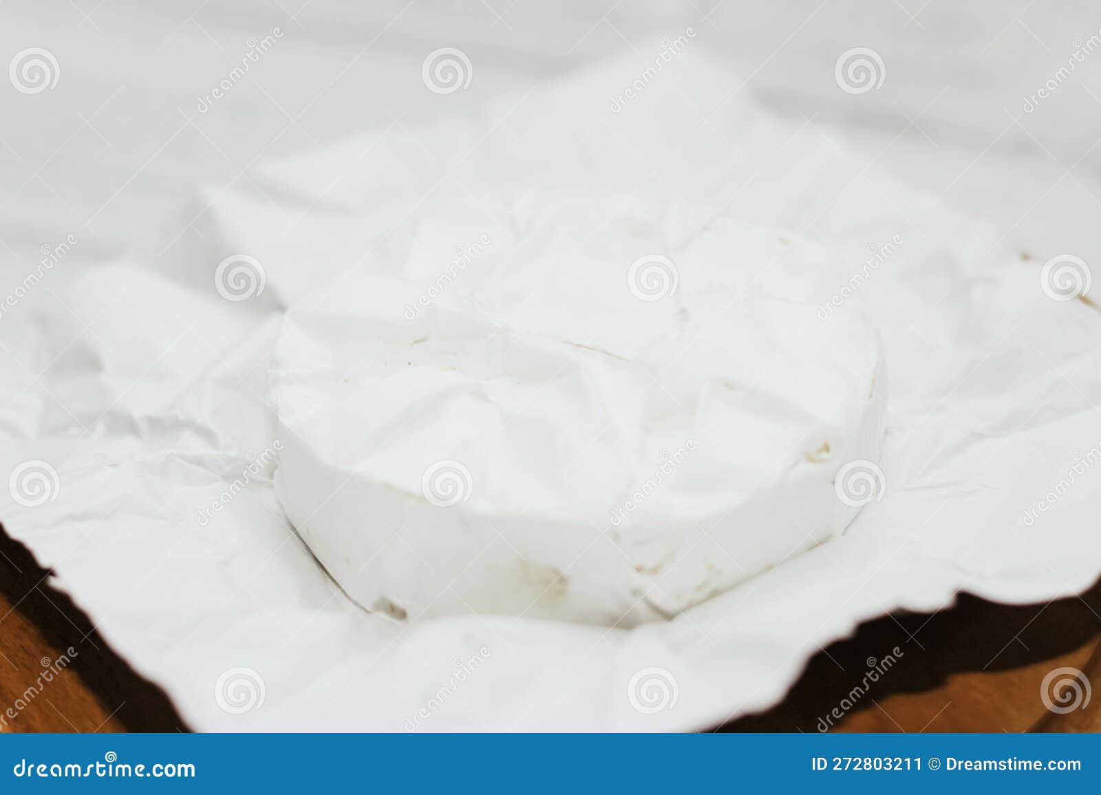 Camembert Cheese Unwrapped from Packaging on the Table. Stock Image ...