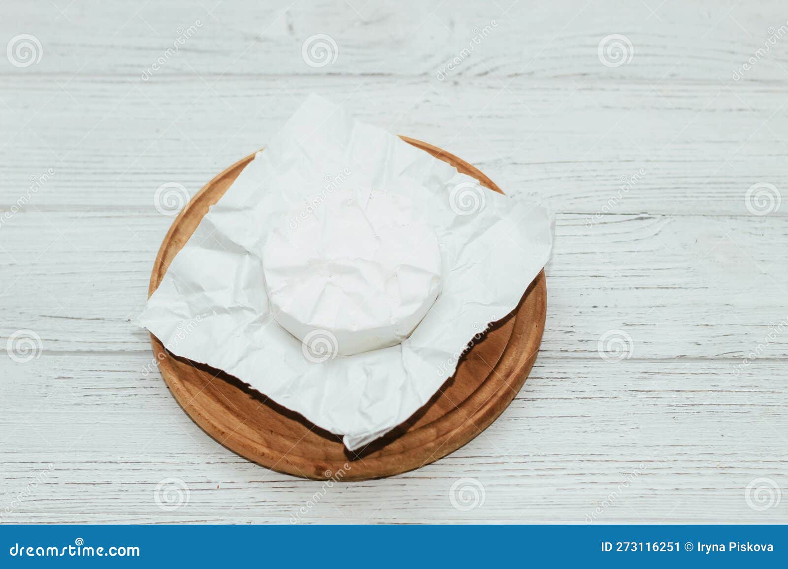 Camembert Cheese Unwrapped from Packaging on the Table. Stock Image ...