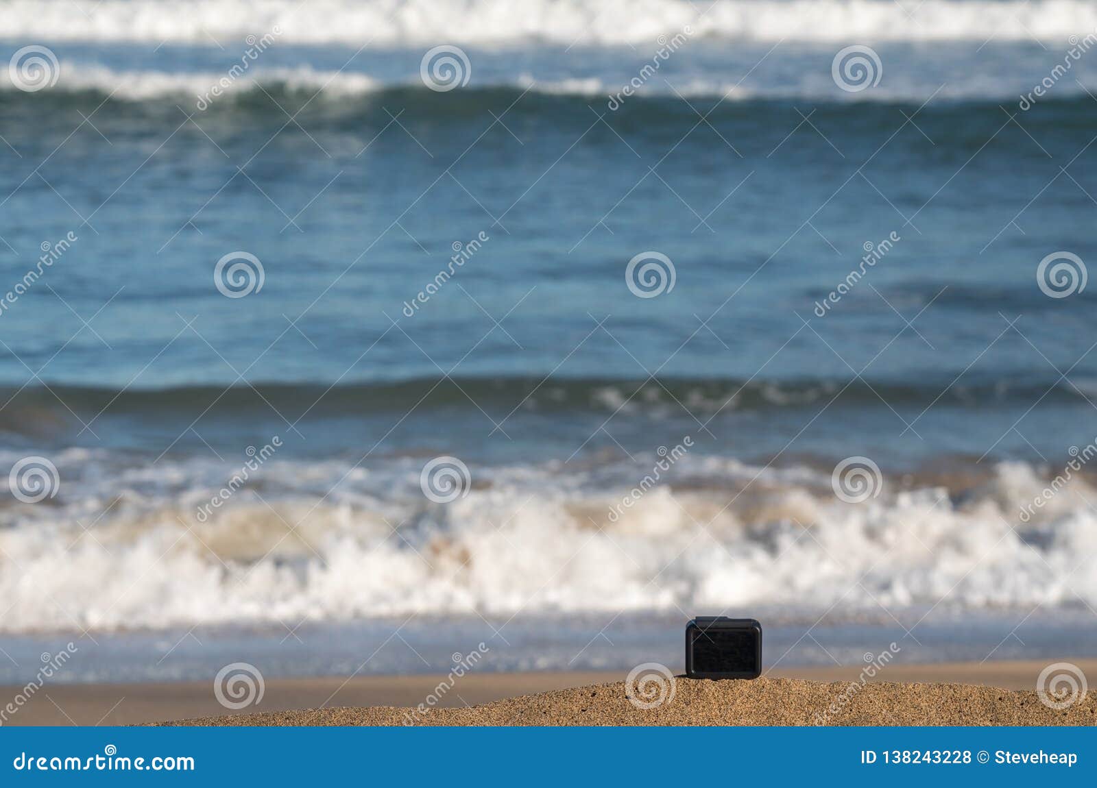 Camera on Beach Taking Timelapse of Rolling Waves Stock Photo - Image ...