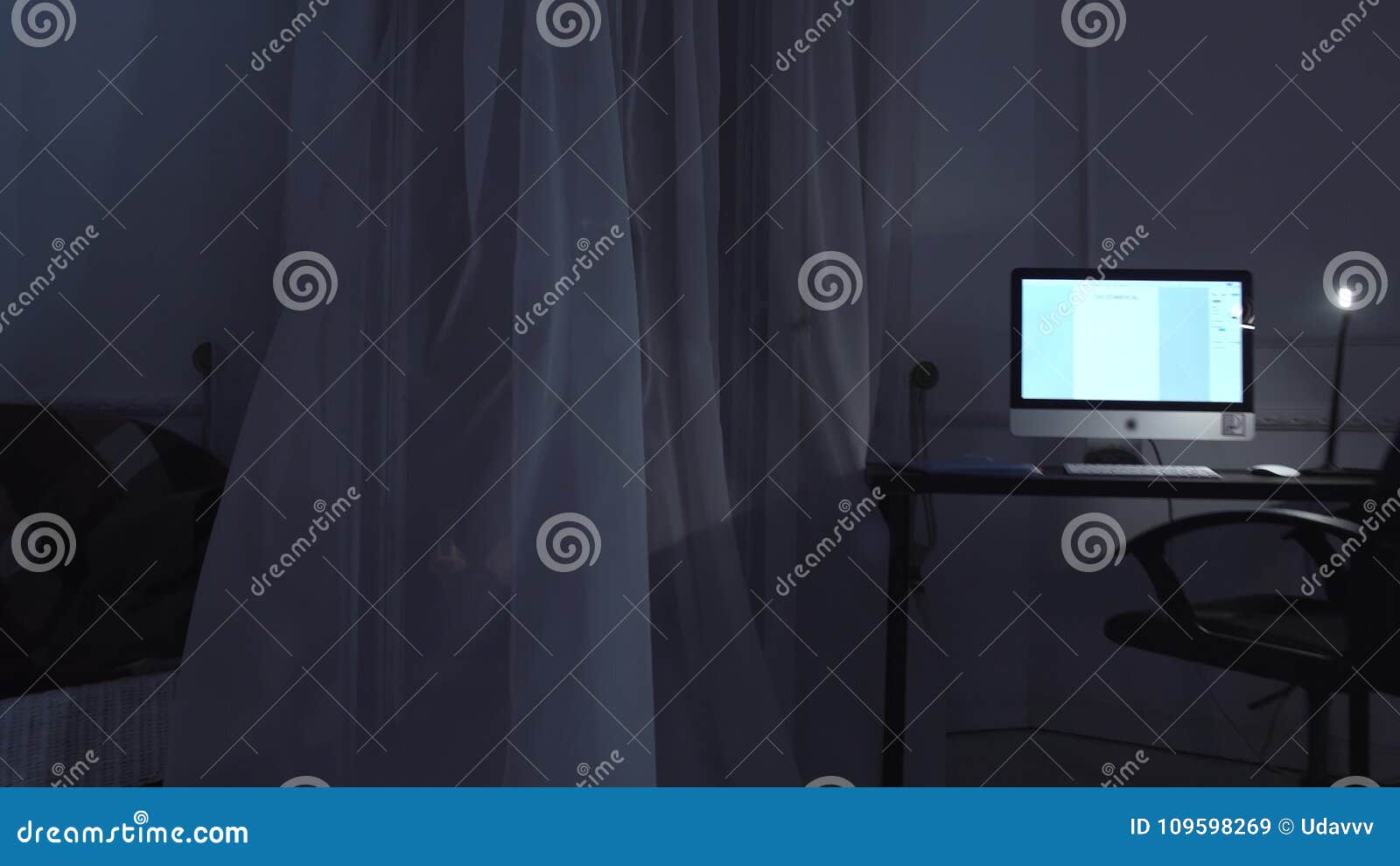 Camera Entering Empty Room with Working Computer from Balcony at Night ...