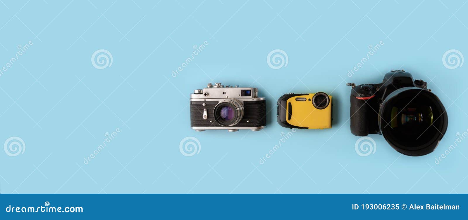 Camera Evolution.Cameras of Different Types and Generations on a Blue ...