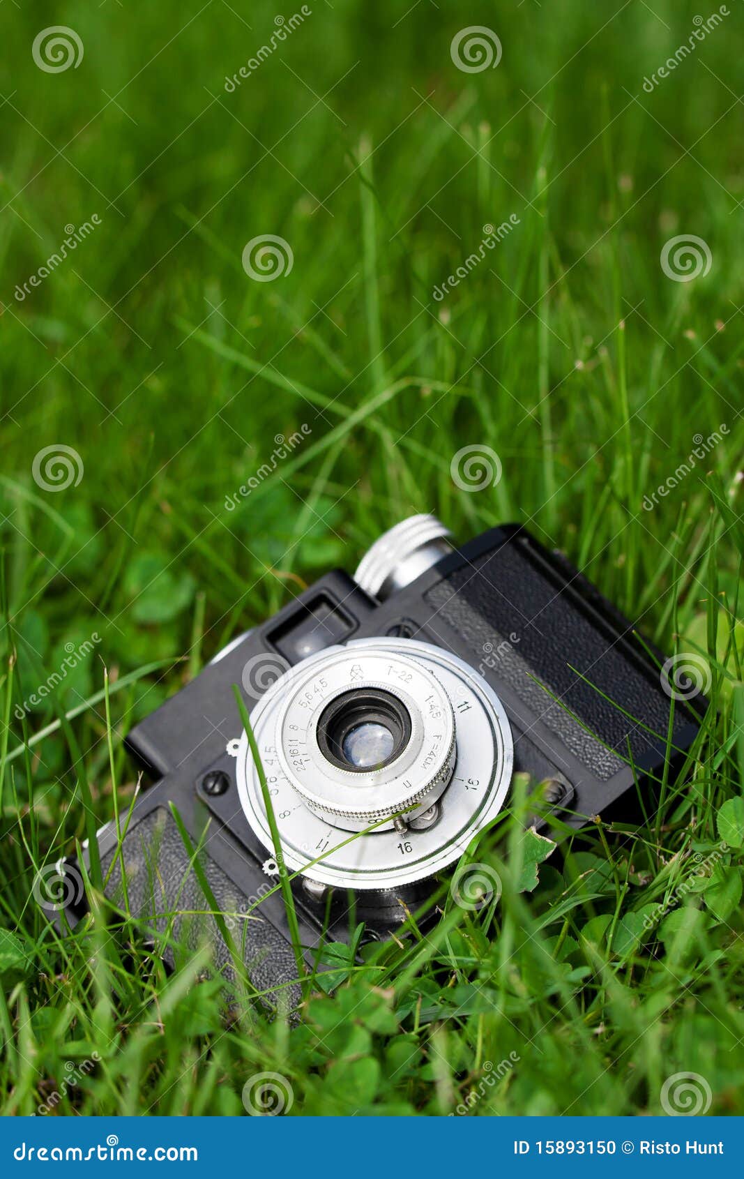 Camera in the grass stock photo. Image of black, classic - 15893150