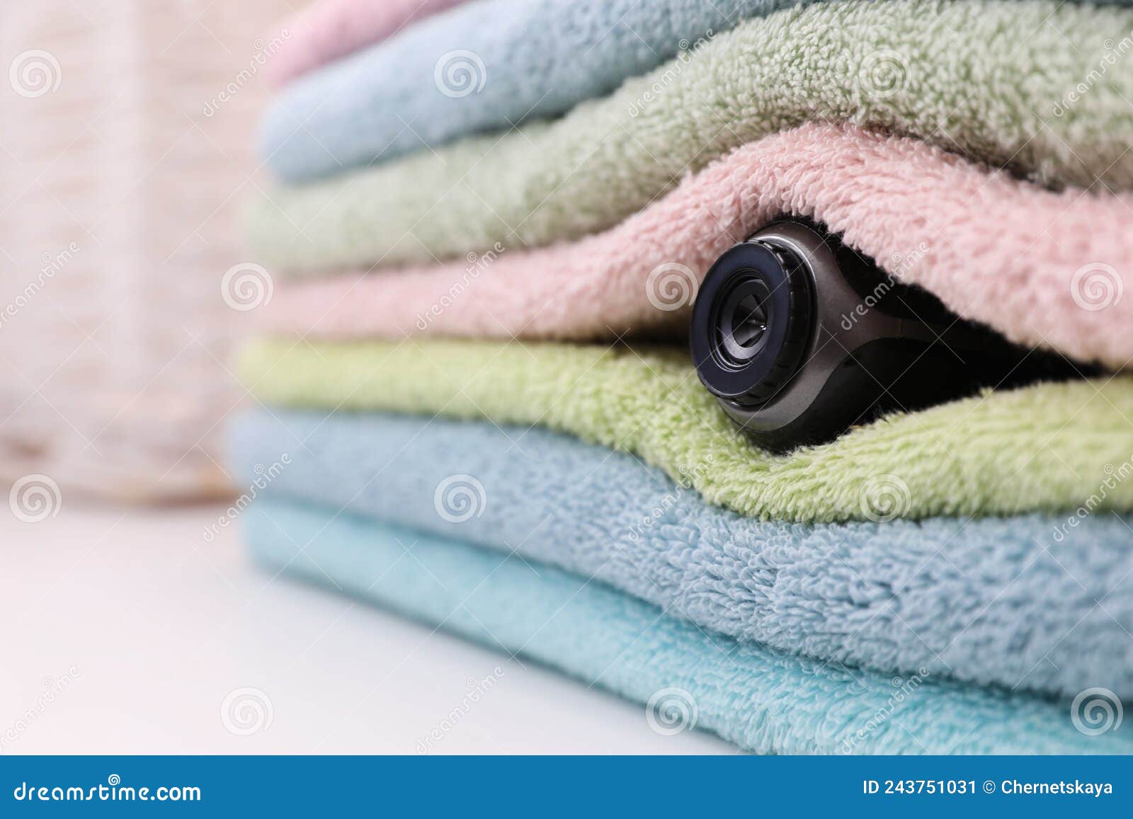 Camera Hidden between Folded Towels Indoors, Closeup. Space for Text ...