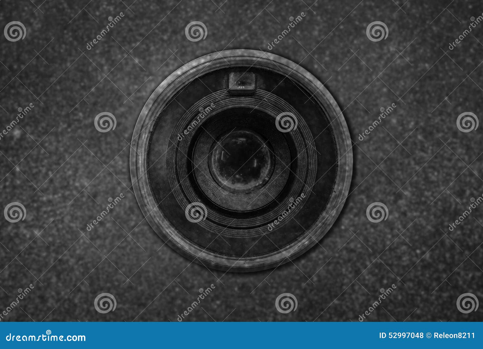 The Camera Lens is on the Background Texture of Rough Asphalt. Stock ...