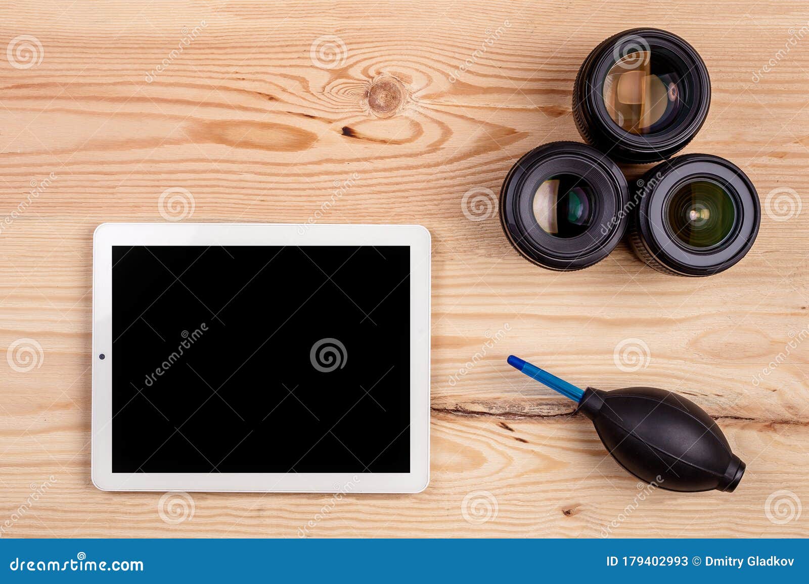 Camera Lenses and Tablet Computer on a Wooden Table Top View ...