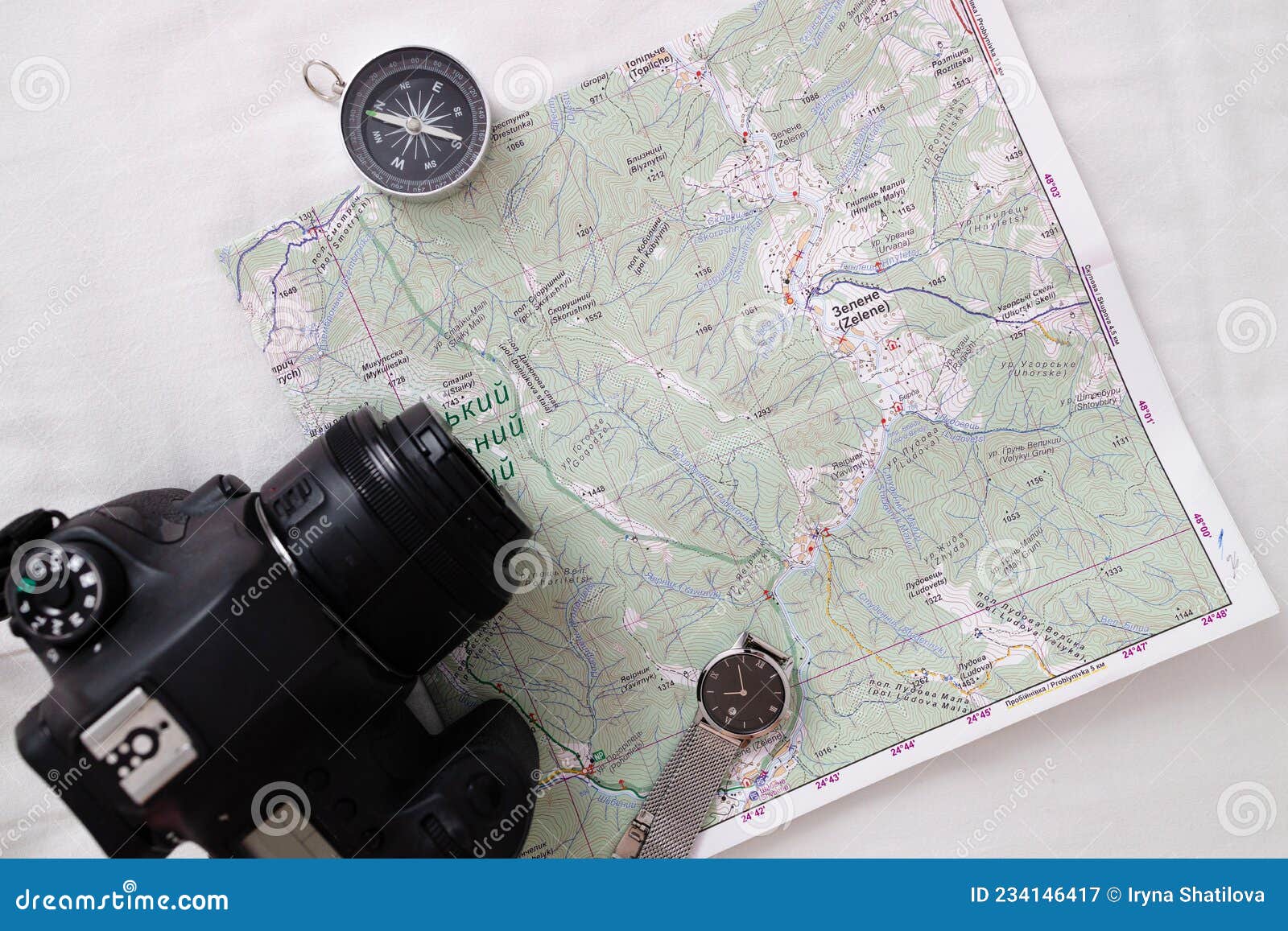 Camera, Magnetic Compass and Clock on the World Map. Adventure ...