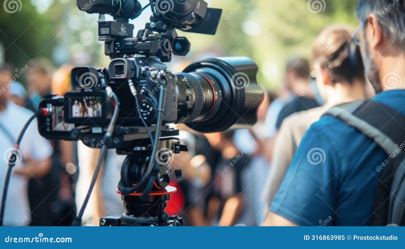 Camera on Tripod in Front of Crowd of People Stock Image - Image of ...