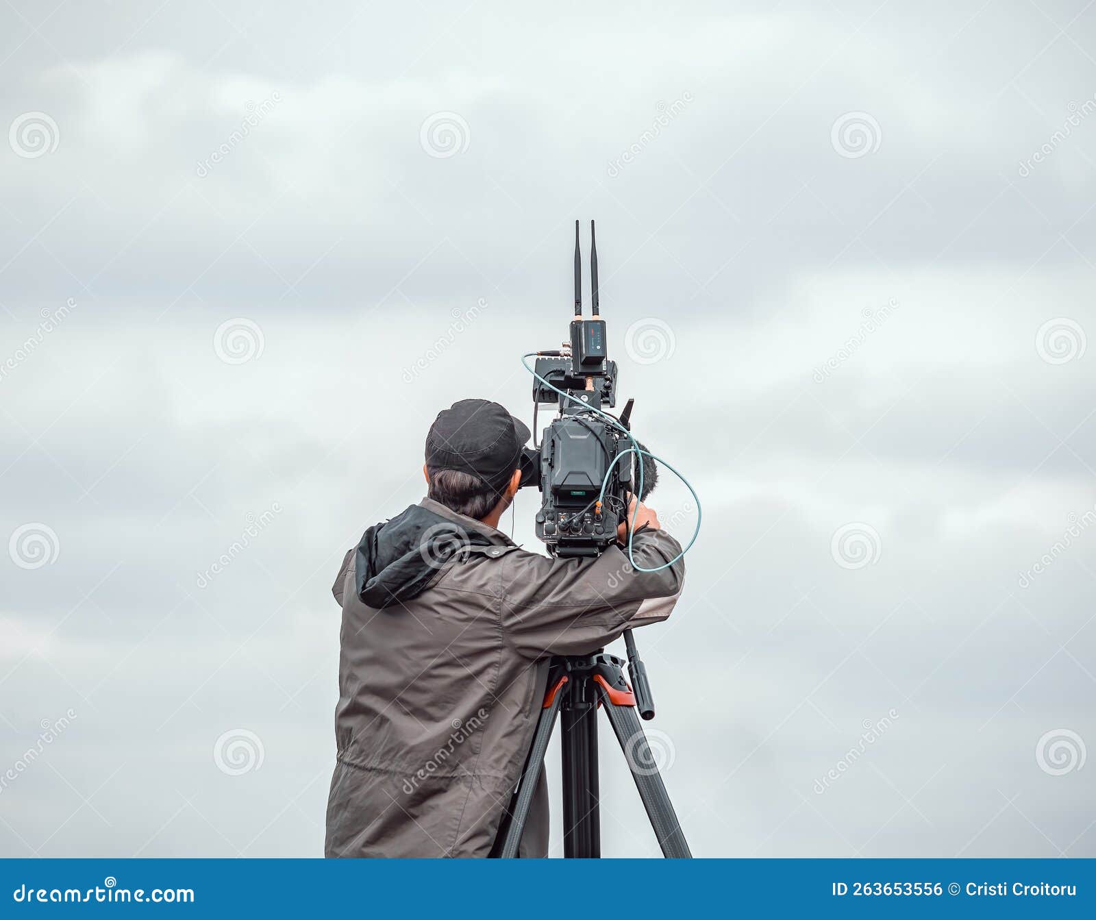 Camera Operator Filming an Event in Bucharest, Romania, Using a Modern ...