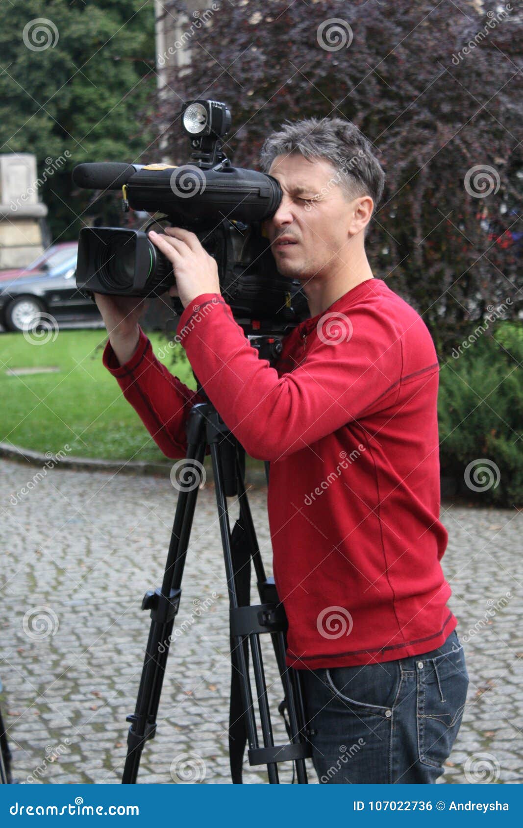 Camera Operator Working with a Cinema Broadcast TV Camera Stock Photo ...