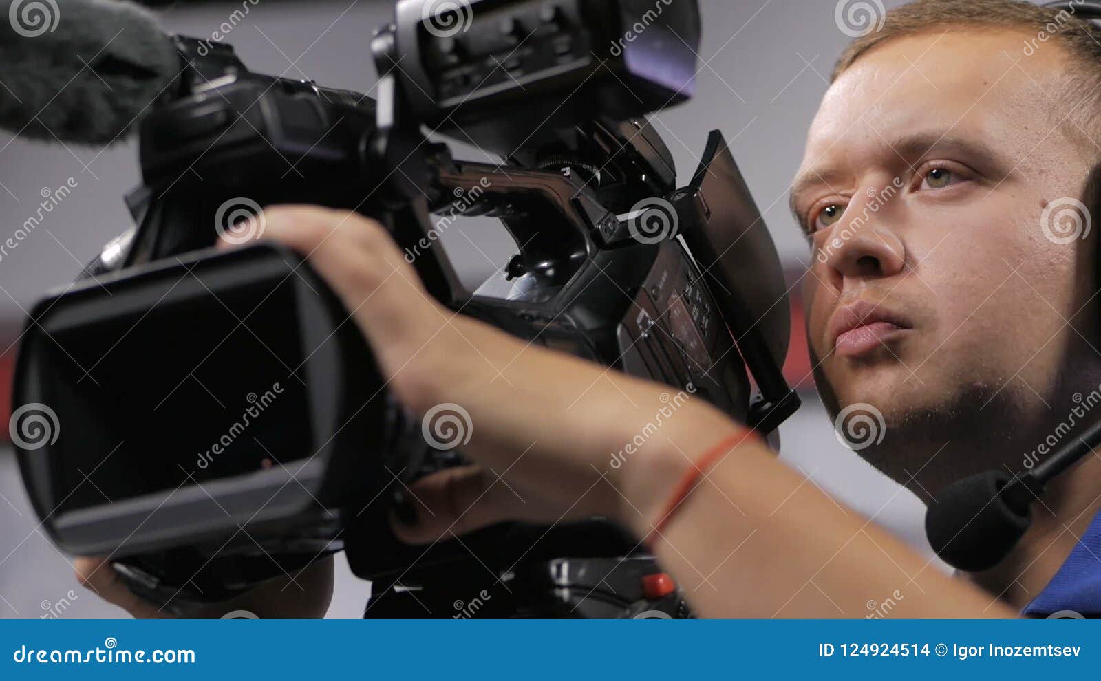 Camera Operator Working with a Cinema Broadcast TV Camera Stock Footage ...